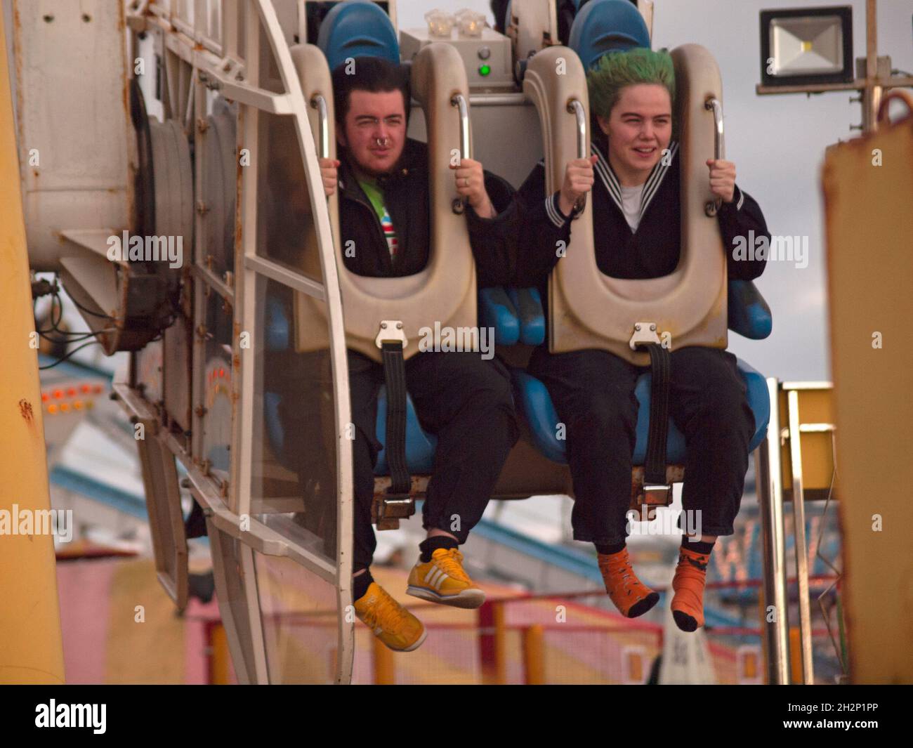 Fun on one of Brighton Palace Pier's amusement rides Stock Photo - Alamy