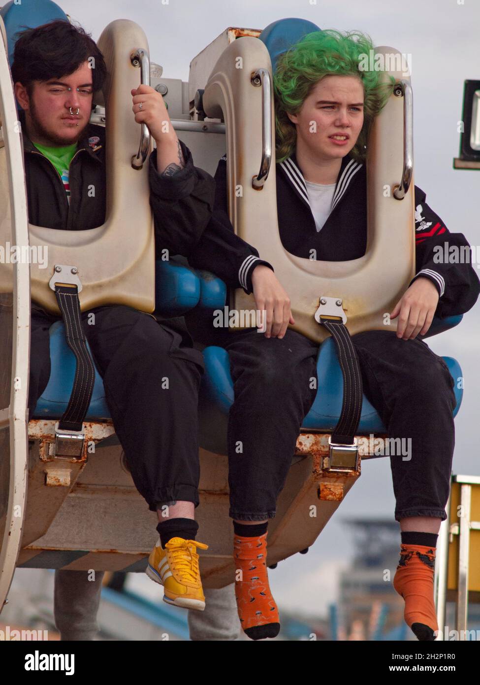 Fun on one of Brighton Palace Pier's amusement rides Stock Photo - Alamy