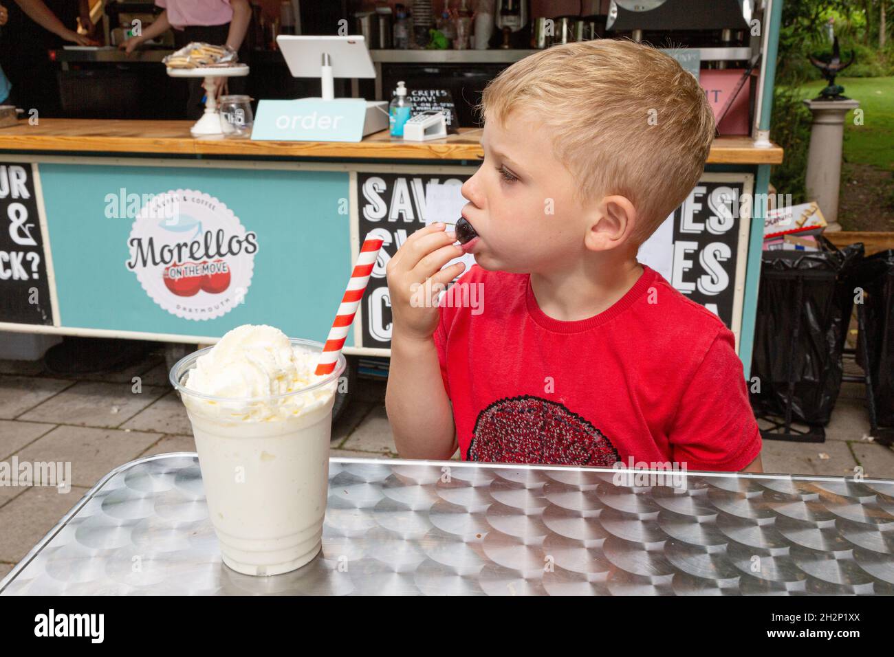 Four year old boy with a milkshake at Morello's milkshake bar ...