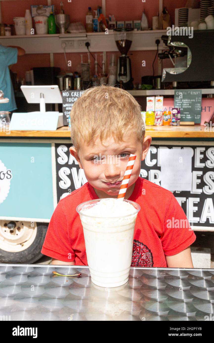 Four year old boy with a milkshake at Morello's milkshake bar ...