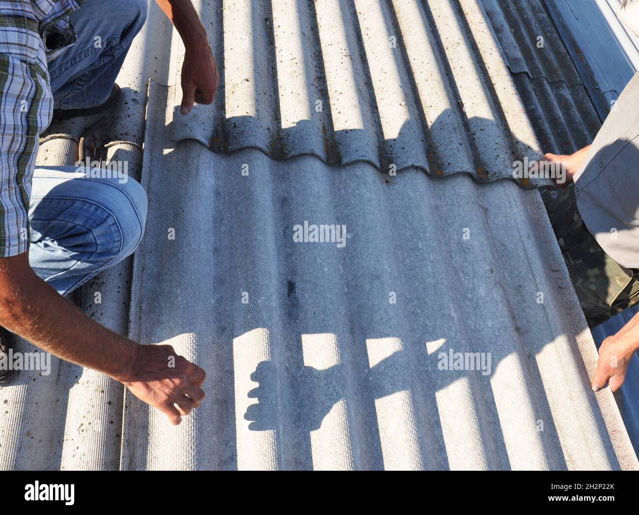 Roofer Repair and Replace Dangerous Asbestos Old Roof Tiles Stock Photo ...