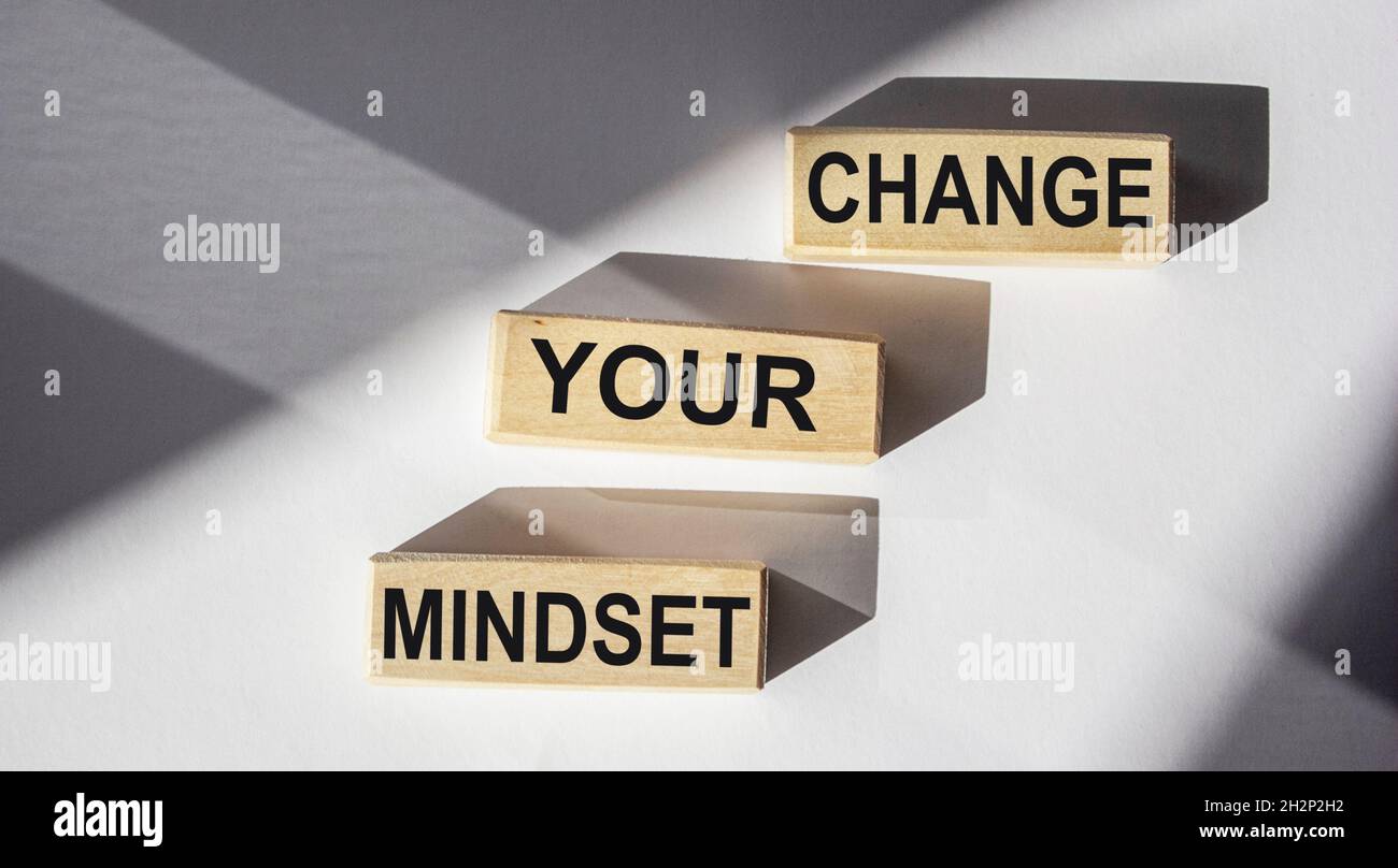 CHANGE YOUR MINDSET written on wooden blocks and white background ...