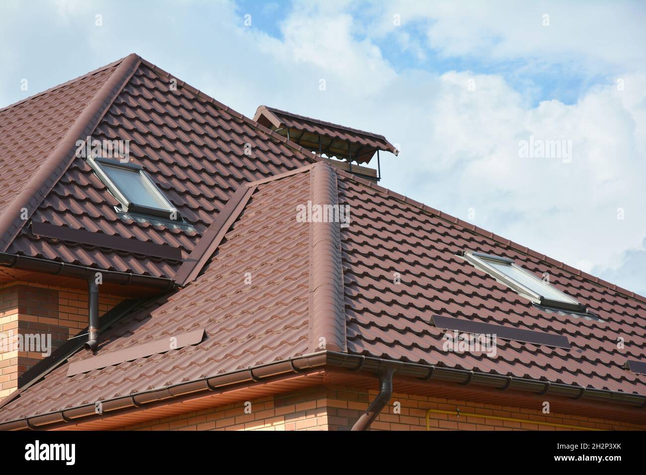 Modern house roofing construction with attic skylights, rain gutter ...