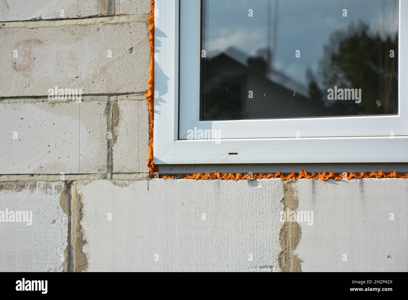 Windows installation and insulation in new house construction building ...