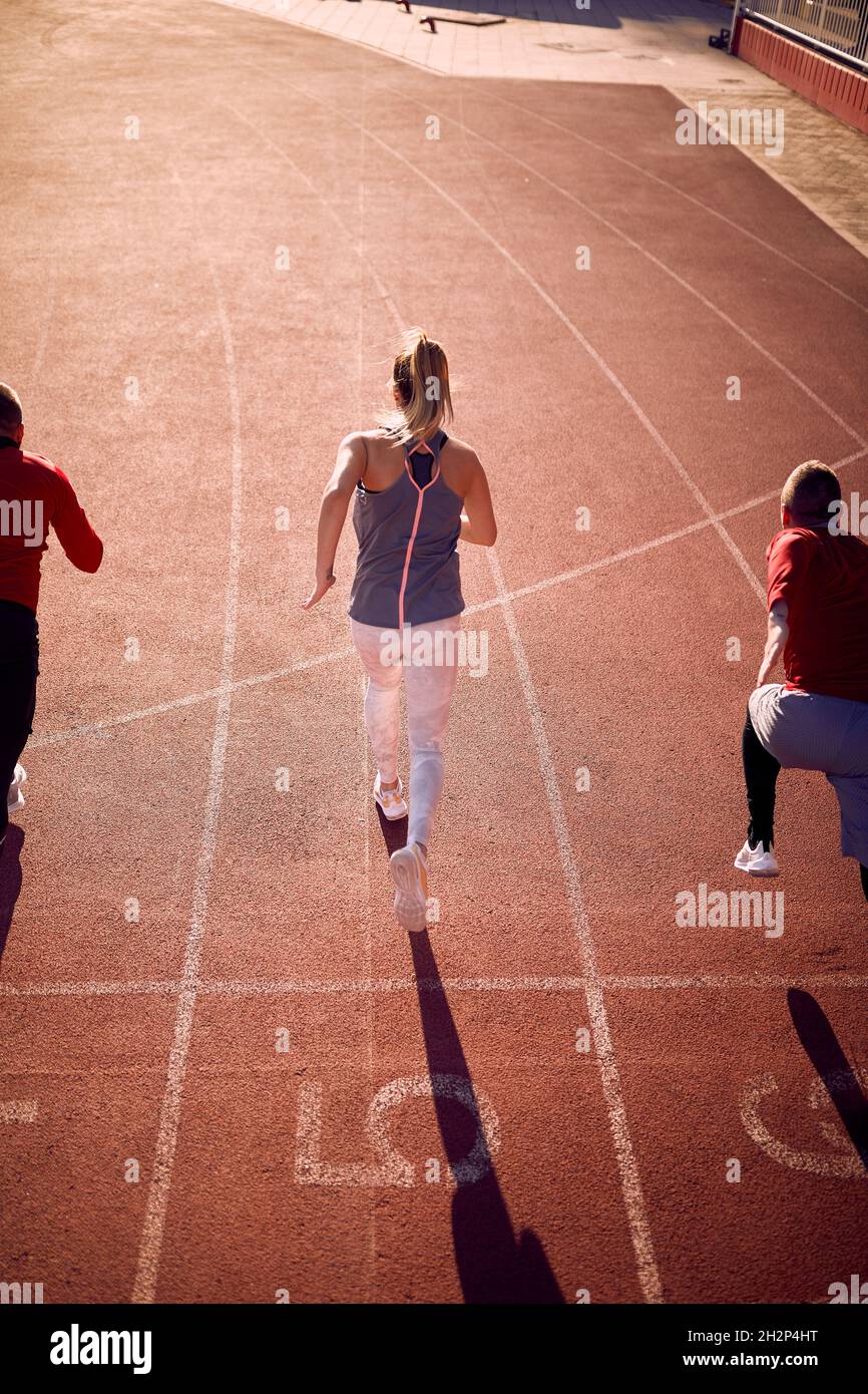 An athletic training at the race track on a beautiful day at the ...