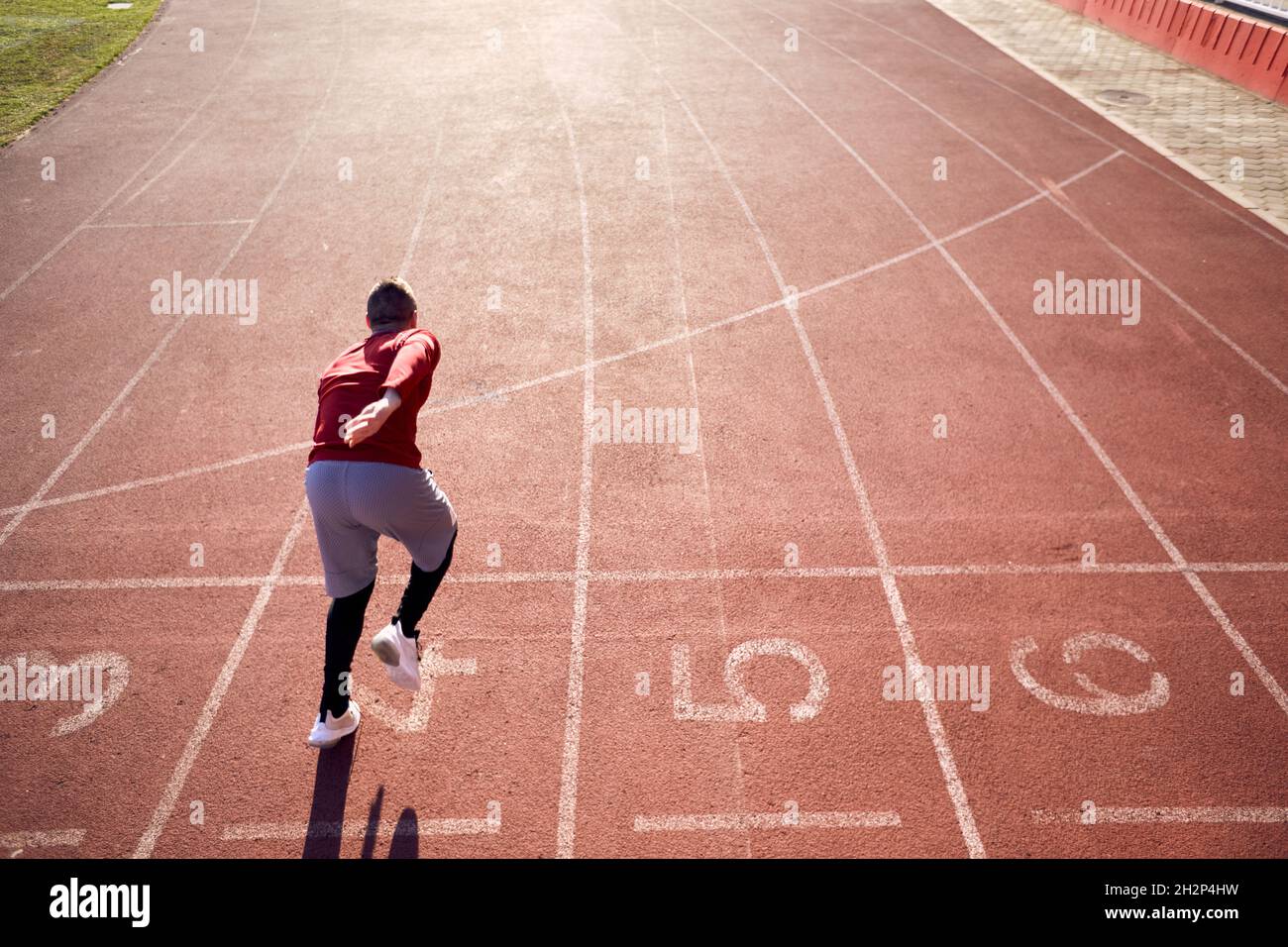 athlete start at run track. image composition with big copy space Stock ...