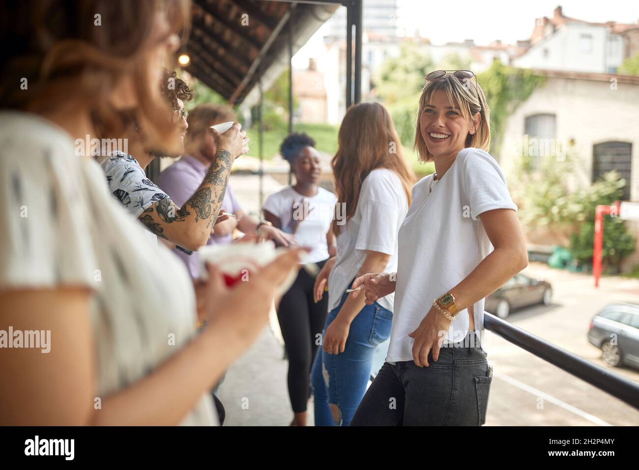 Group of young employees having a break together Stock Photo - Alamy