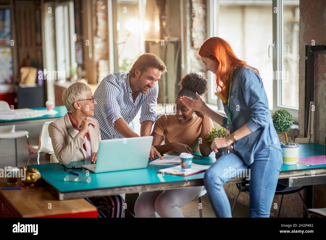 Group of employees working together at the office Stock Photo - Alamy