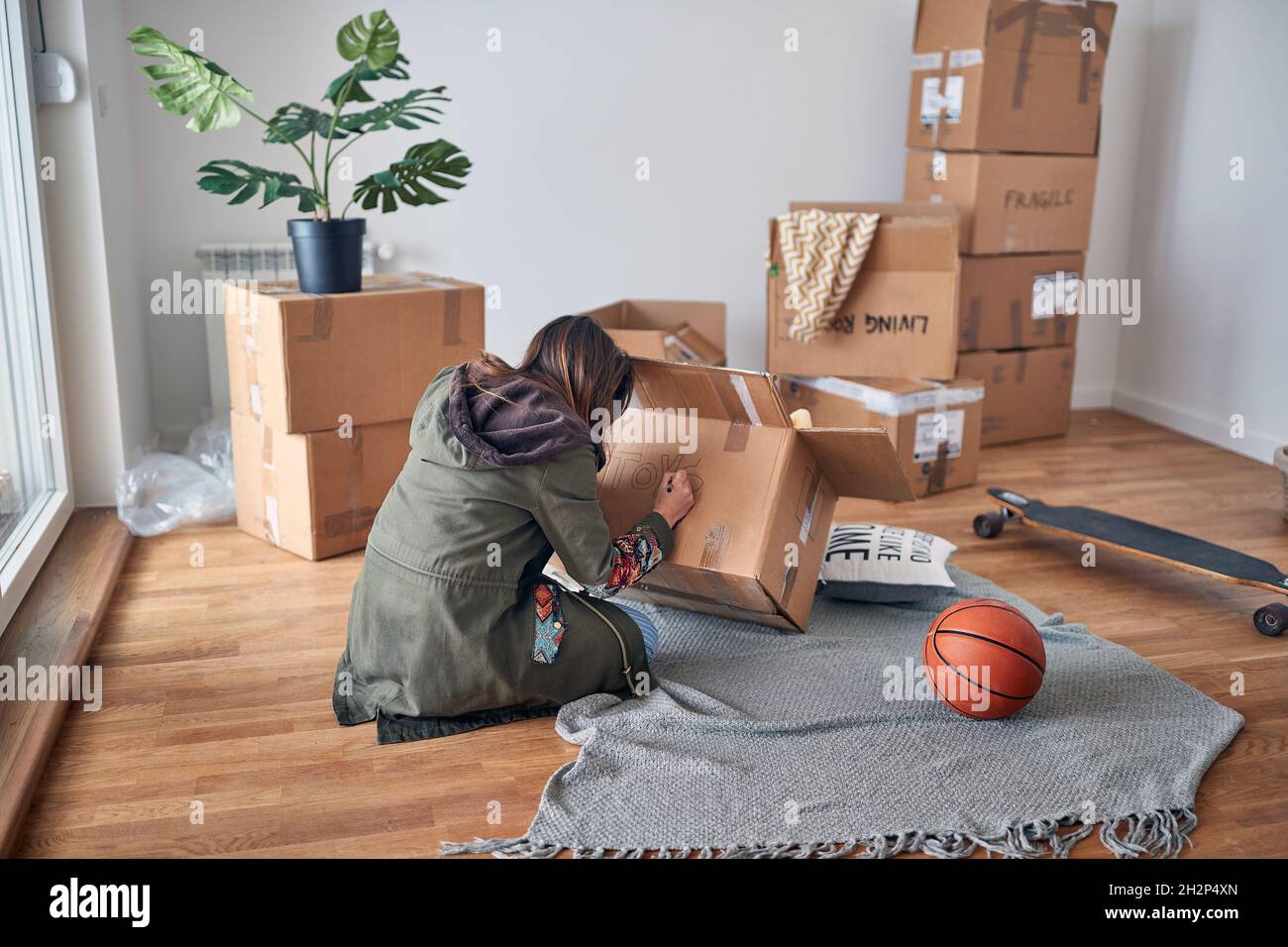 woman mark boxes,ready for move out.packing, moving, concept Stock ...