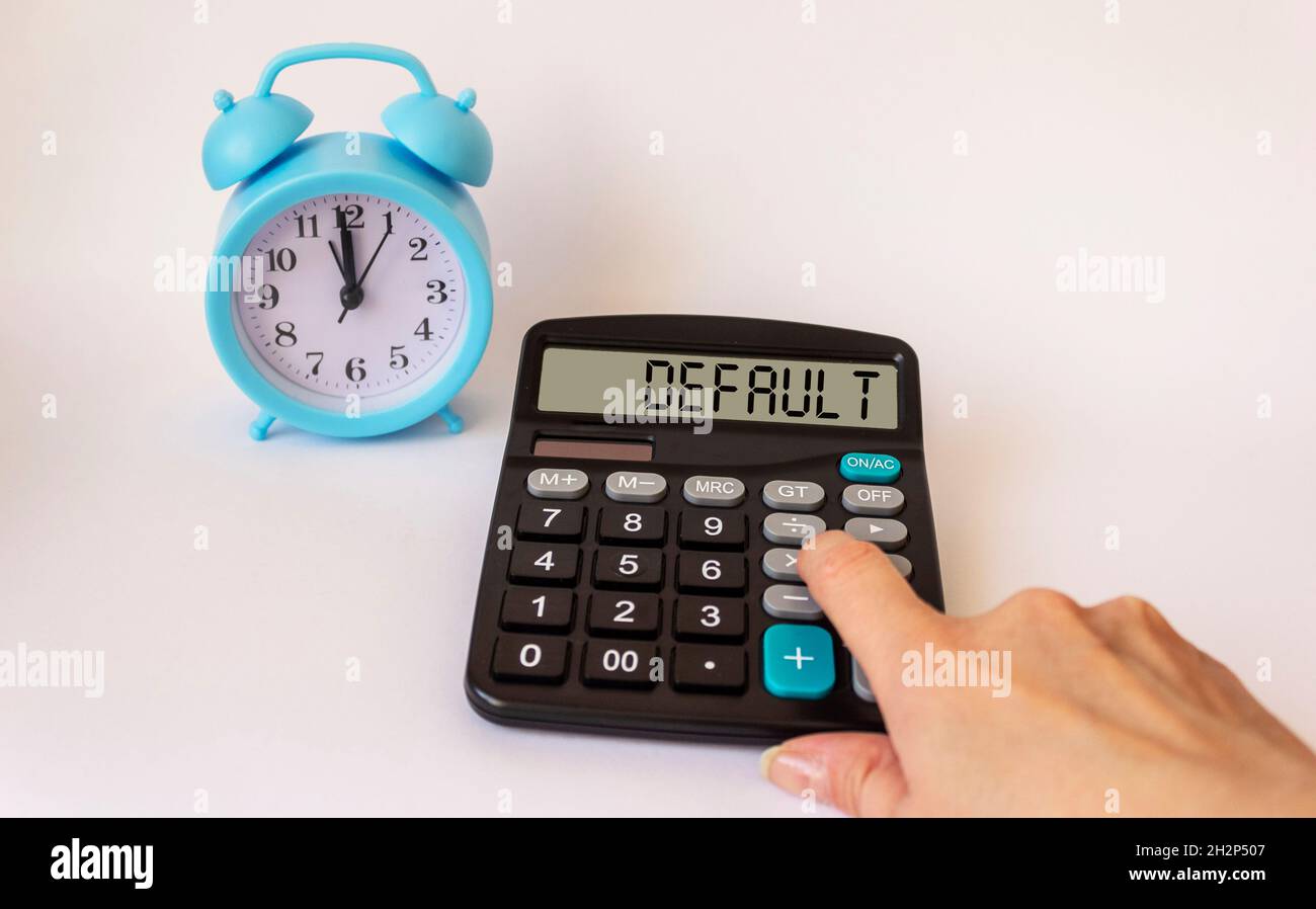 DEFAULT calculator on display isolated on white background, near an ...