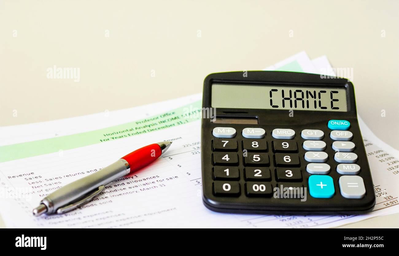 Calculator with the word CHANCE on the display. Money, finance and ...