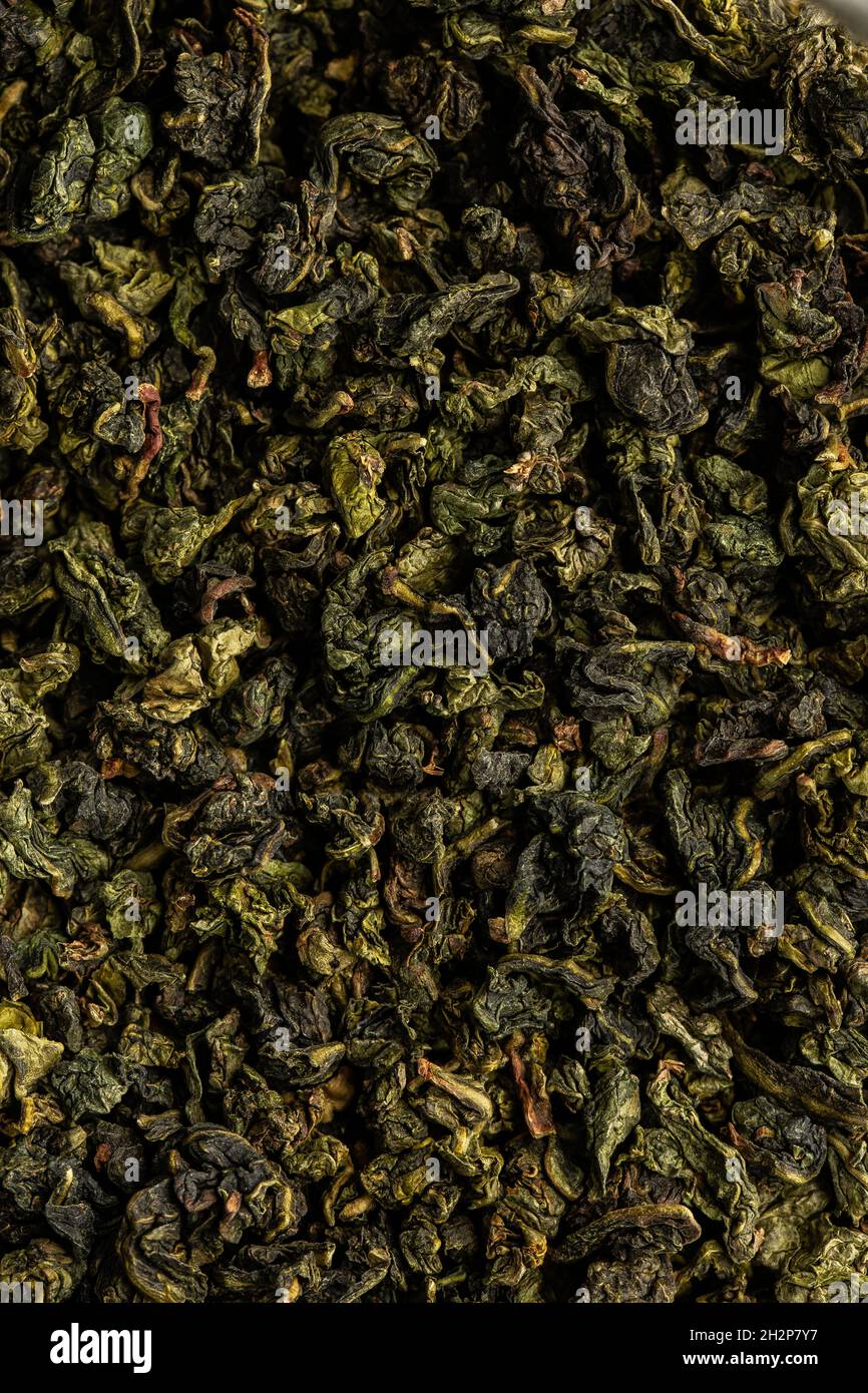 Heap of dry tea leaves. Dried green tea. Textured background of dried ...