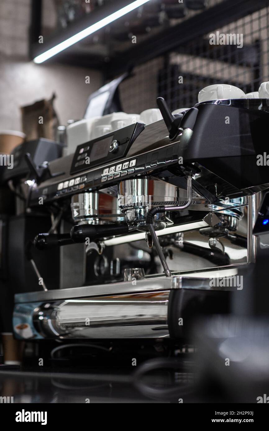 Close up of traditional Espresso Coffee Machine. Flowing fresh ground ...