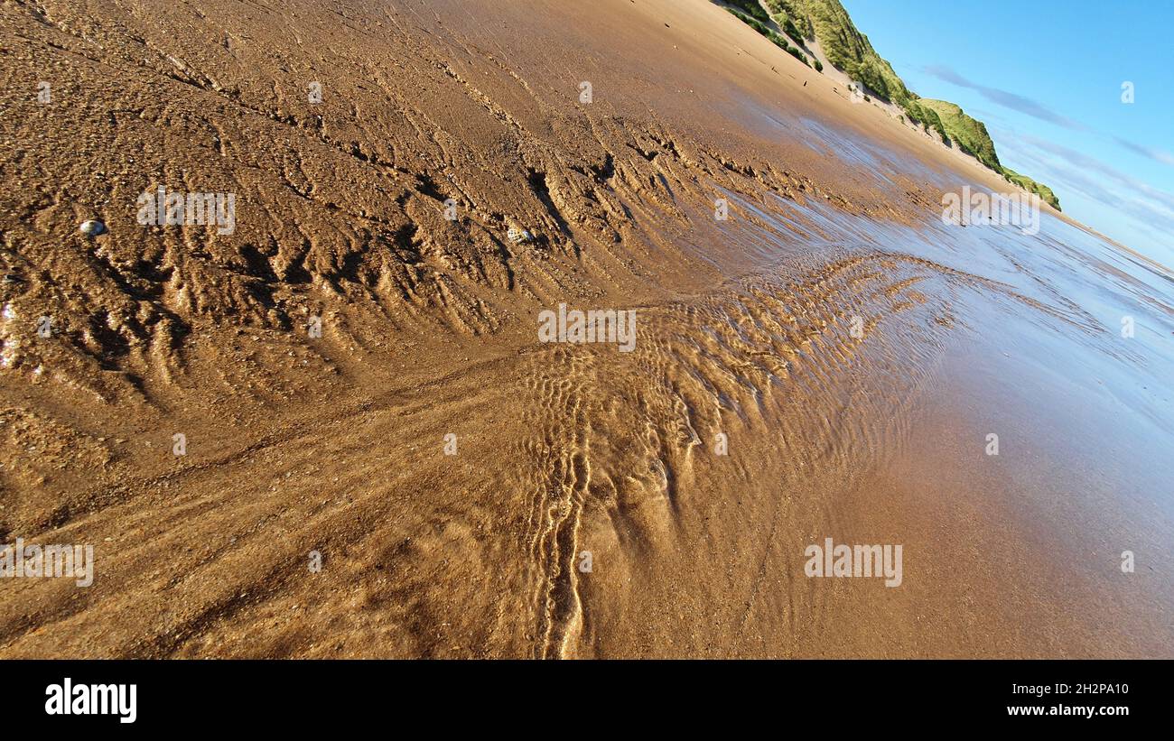 Patterns and textures in sand Stock Photo - Alamy