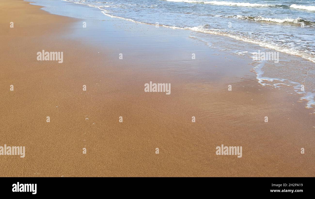 Empty beach with sand and sea Stock Photo - Alamy