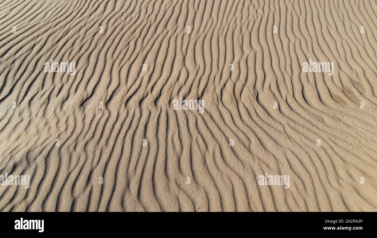 Patterns and texture in sand Stock Photo - Alamy