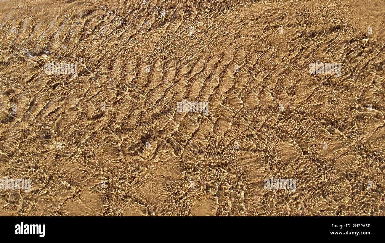 Pattern and textures in sand Stock Photo - Alamy