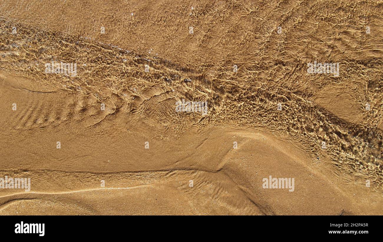 Pattern and textures in sand Stock Photo - Alamy