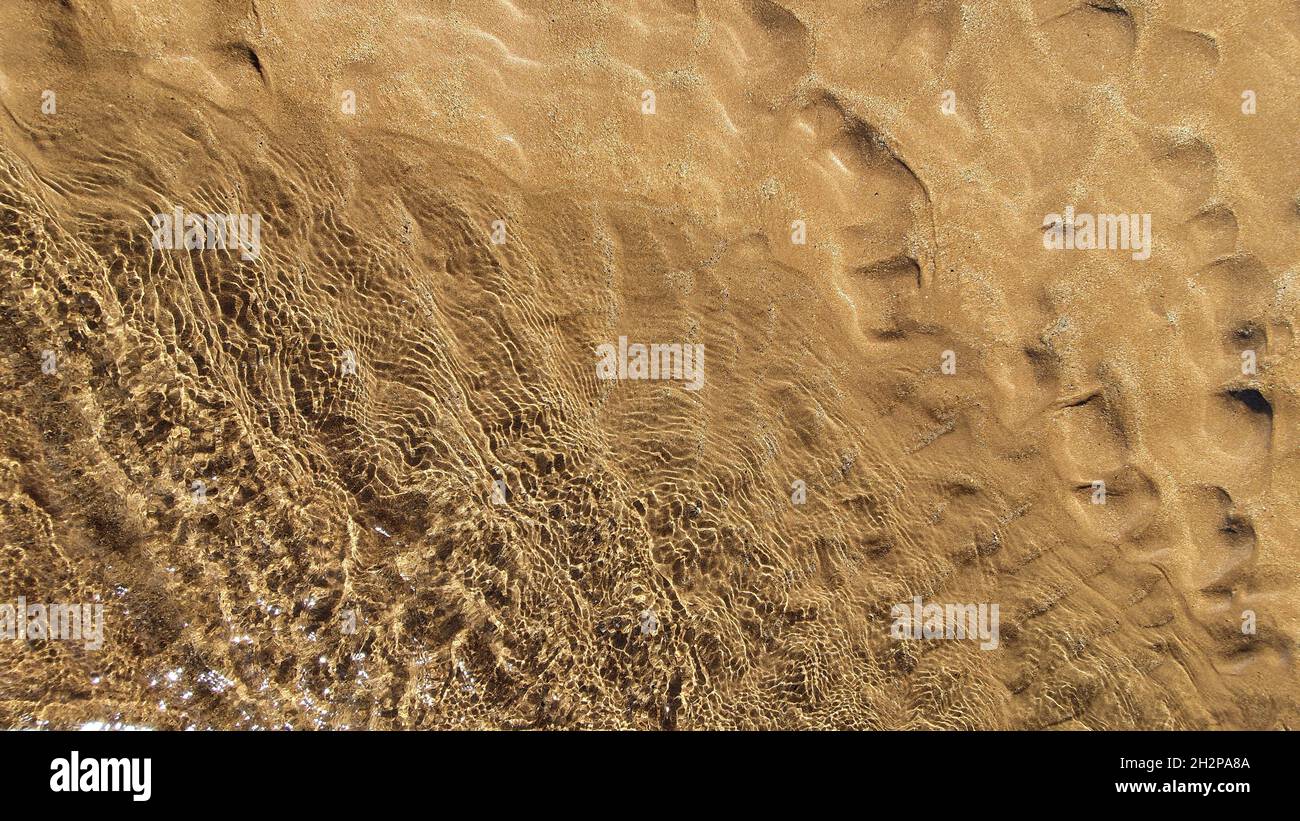 Pattern and textures in sand Stock Photo - Alamy