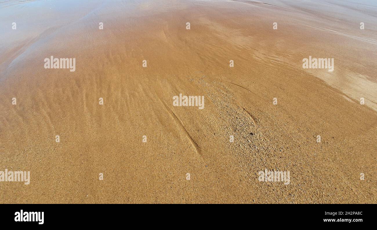 Pattern and textures in sand Stock Photo - Alamy