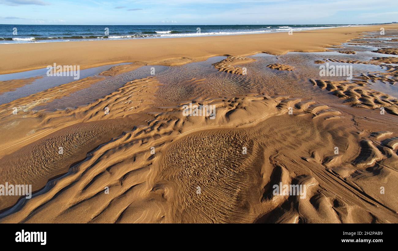 Pattern and textures in sand Stock Photo - Alamy