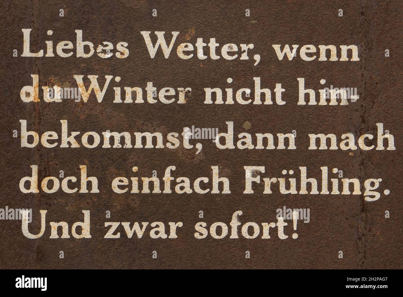 funny saying on metal sign. to grin Stock Photo - Alamy