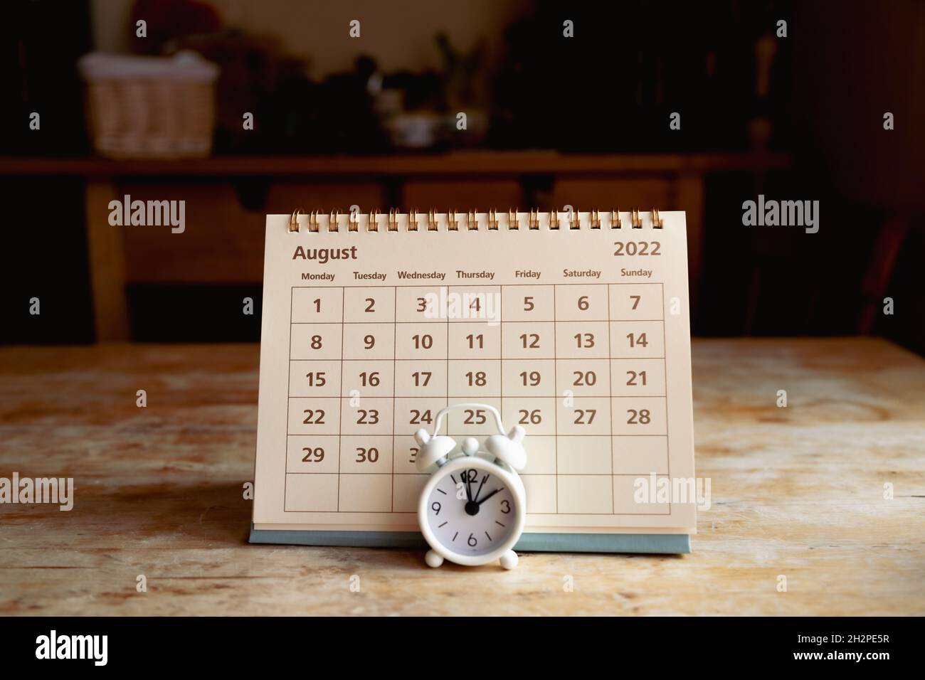 August 2022 calendar month page nad little vintage alarm clock Stock ...