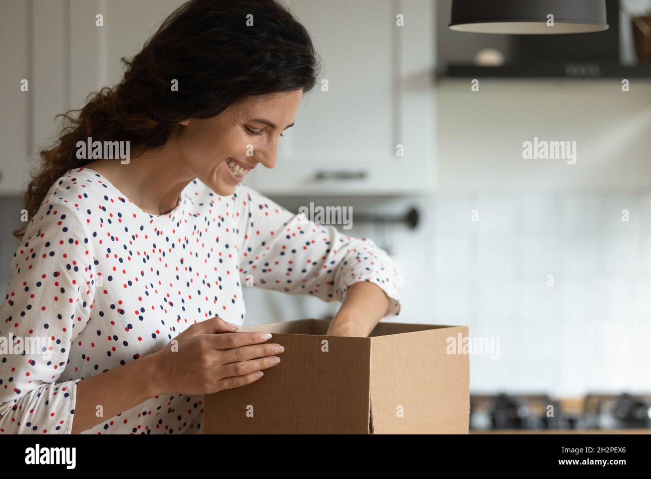 Happy excited online shop customer receiving order Stock Photo - Alamy