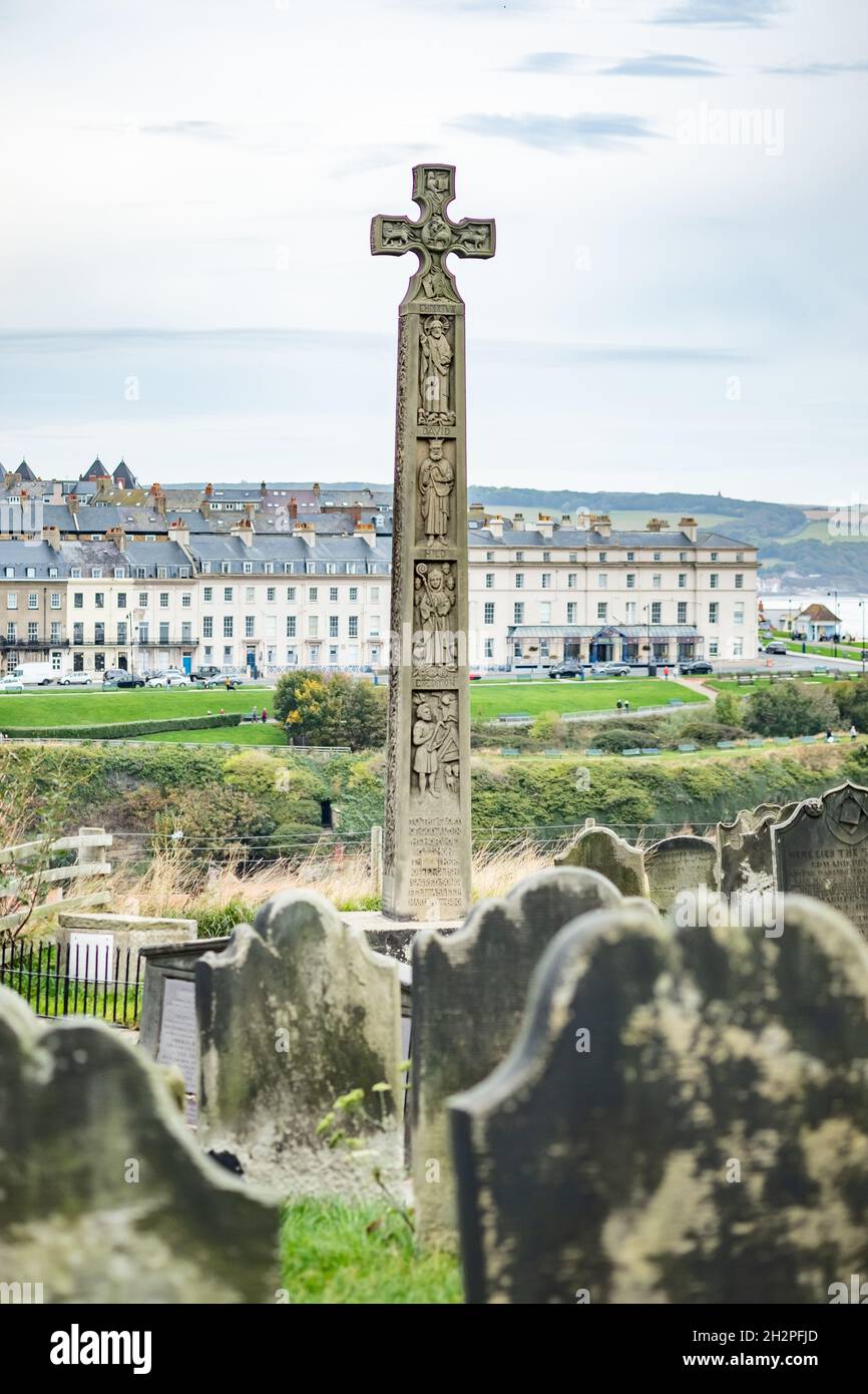 Whitby, Yorkshire, UK – October 20 2021. Caedmon’s Cross in St Mary’s ...