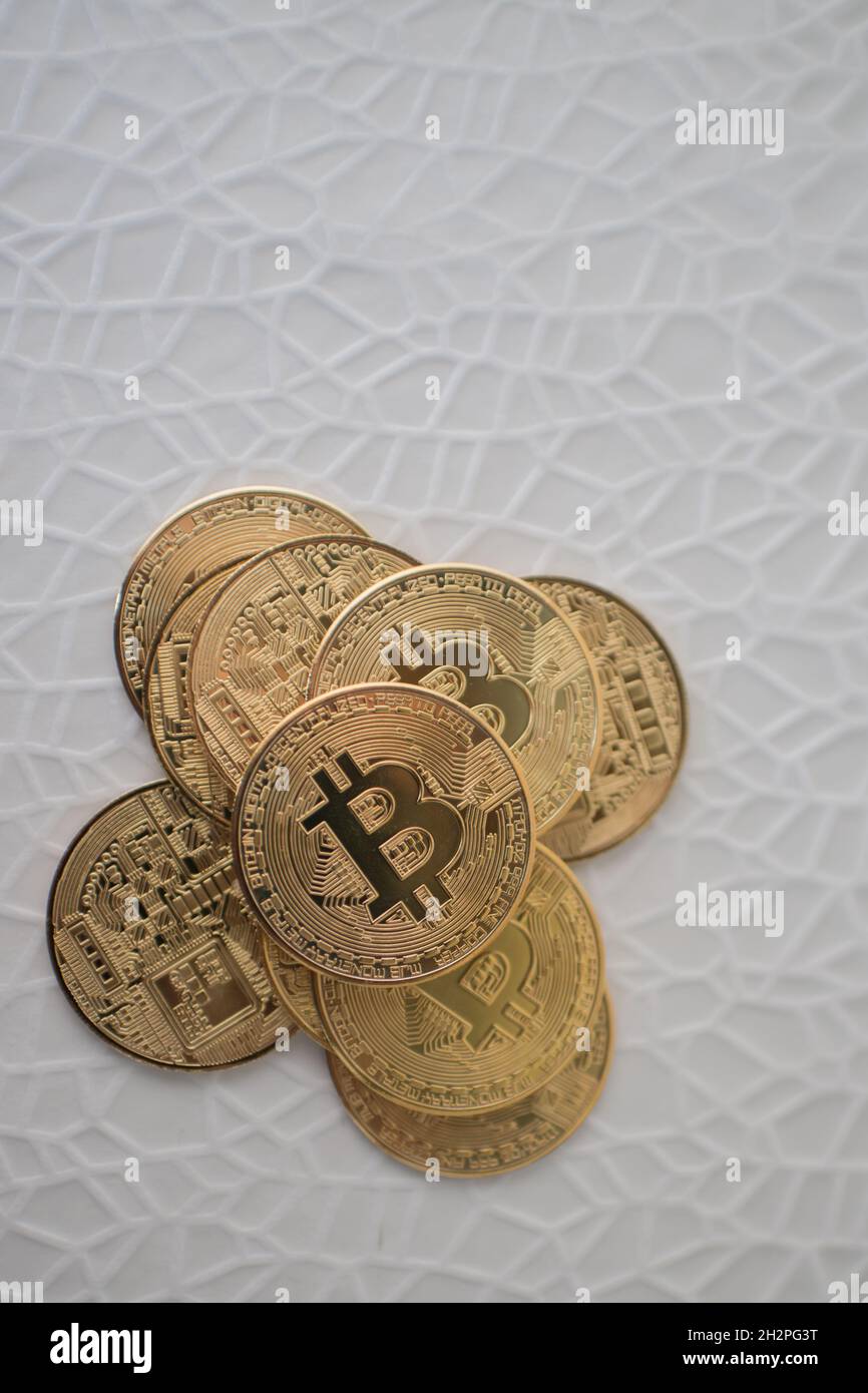 Pile of bright coins with white background. Crypto currency. Risk Stock ...