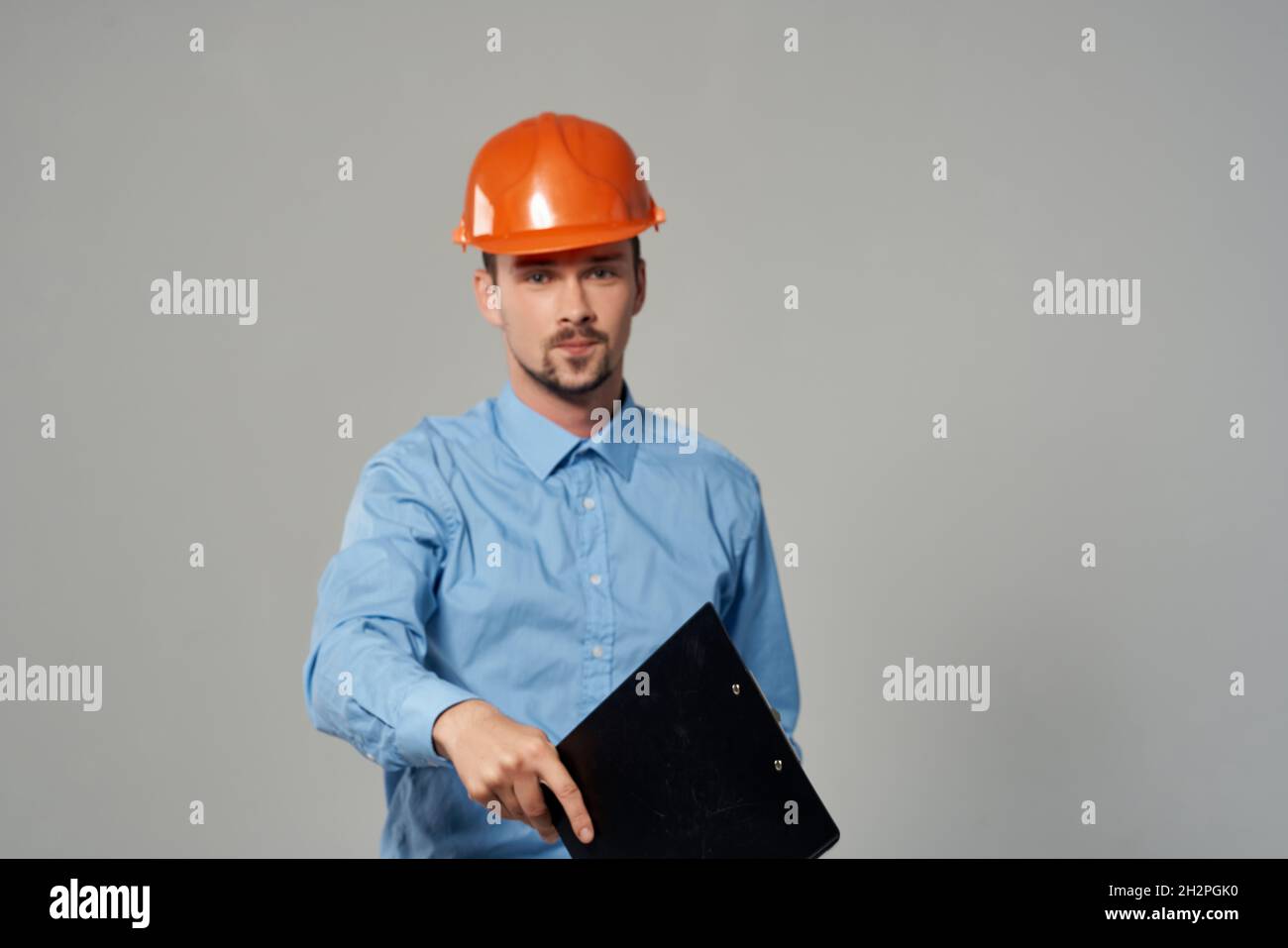 male builders blueprints builder light background Stock Photo - Alamy