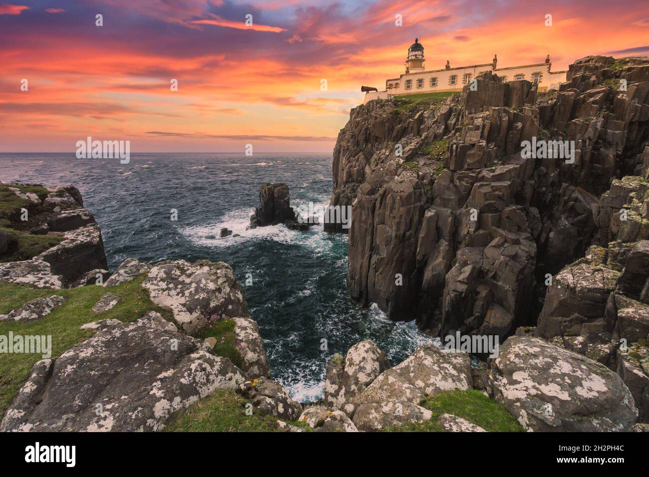 Lighthouse on Neist Point cliffs, Isle of Skye, Scotland Stock Photo ...