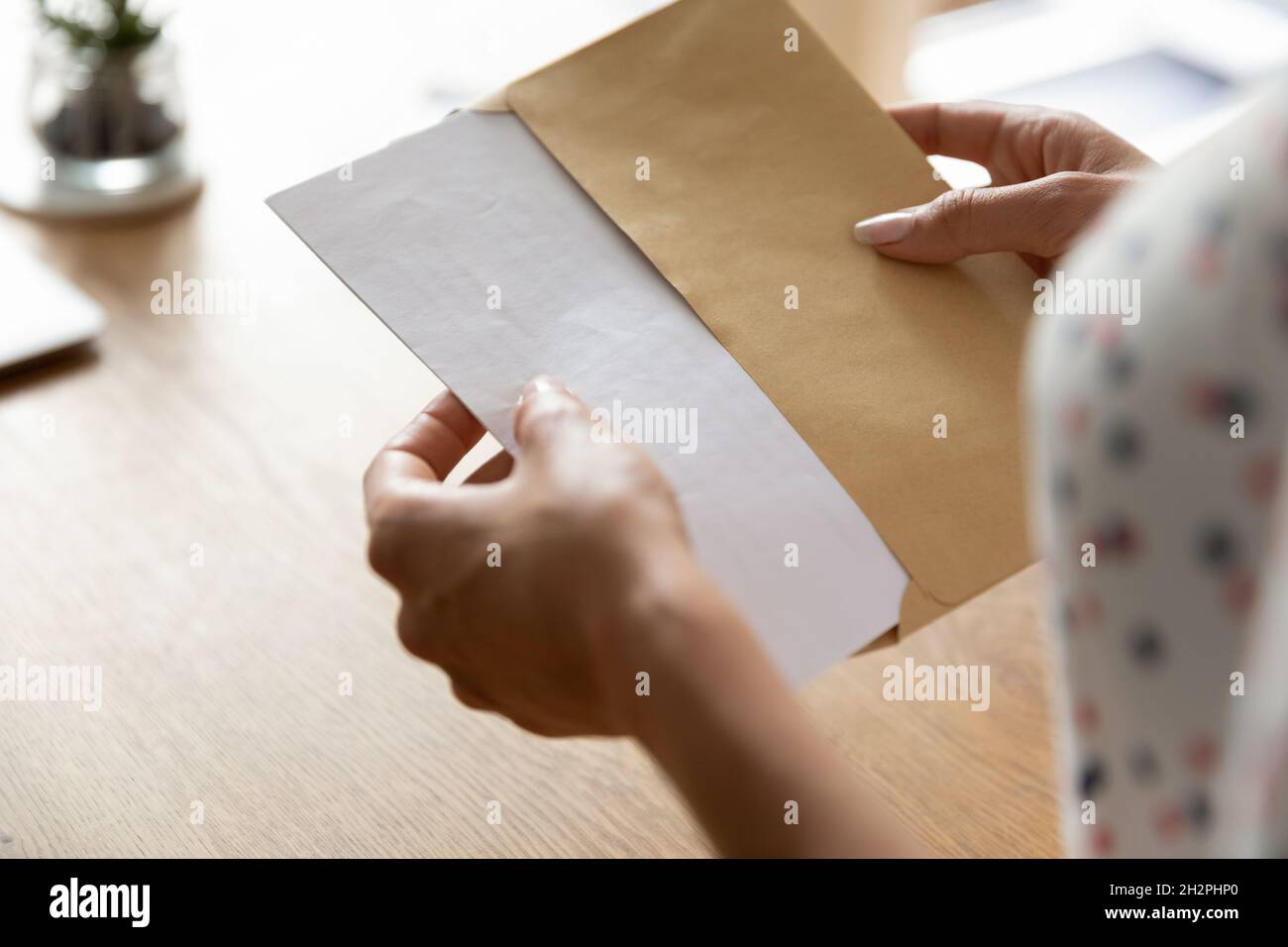 Hands of woman receiving letter, invitation, notification, postcard ...