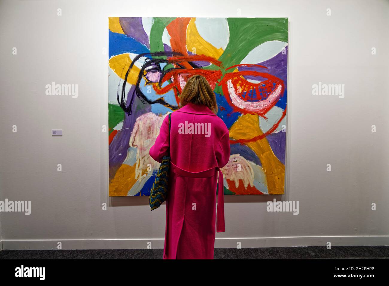 Visitors stand contemporary painting hi-res stock photography and ...