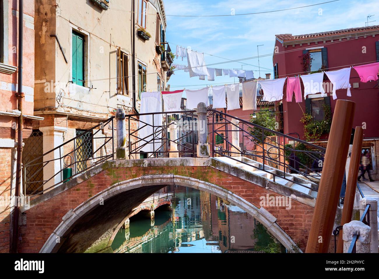 Washing lines across canal in Venice, Italy. Laundry hanging on a ...