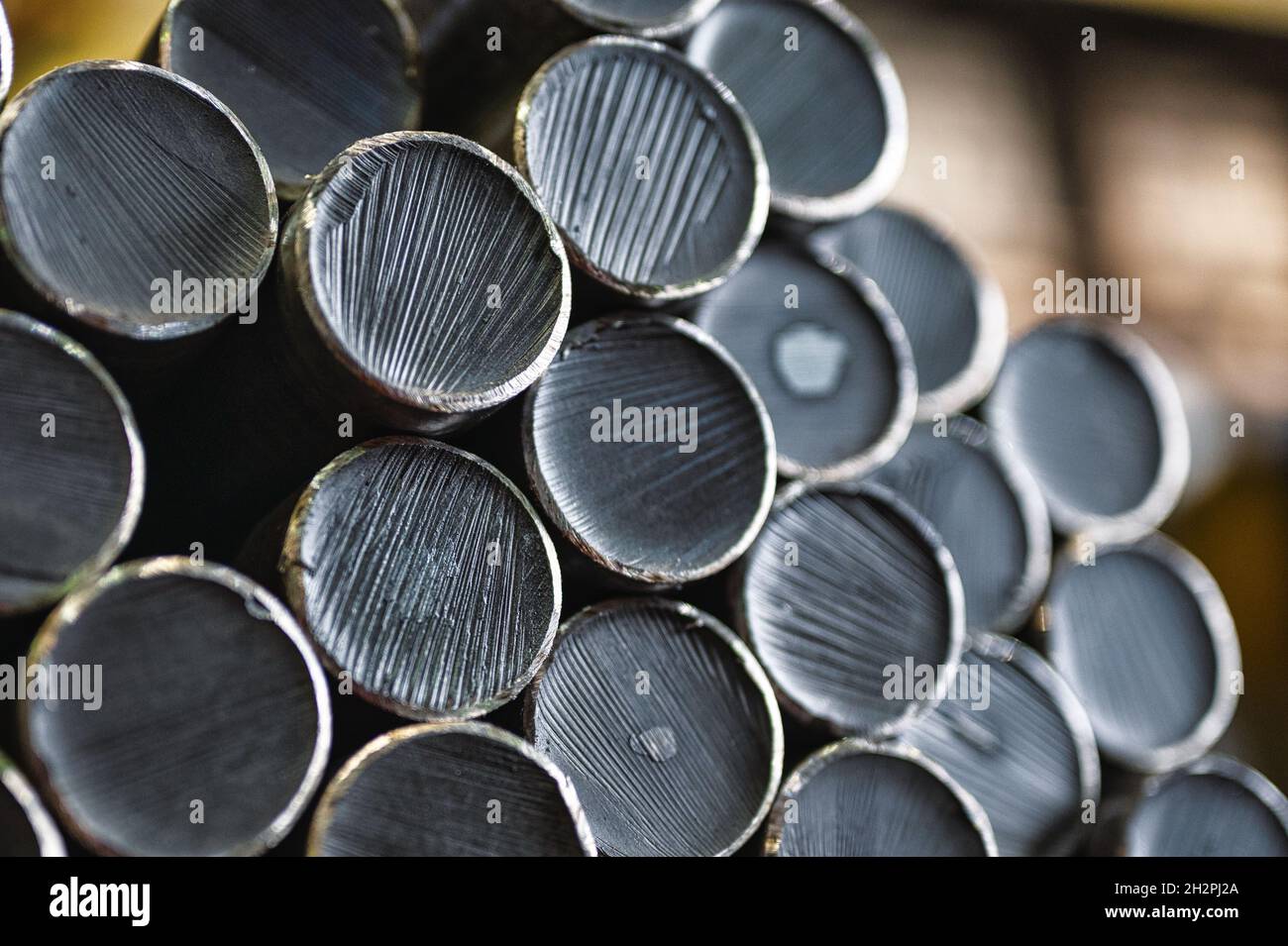 Hot rolled steel, stack of round thick metal rods close-up Stock Photo ...