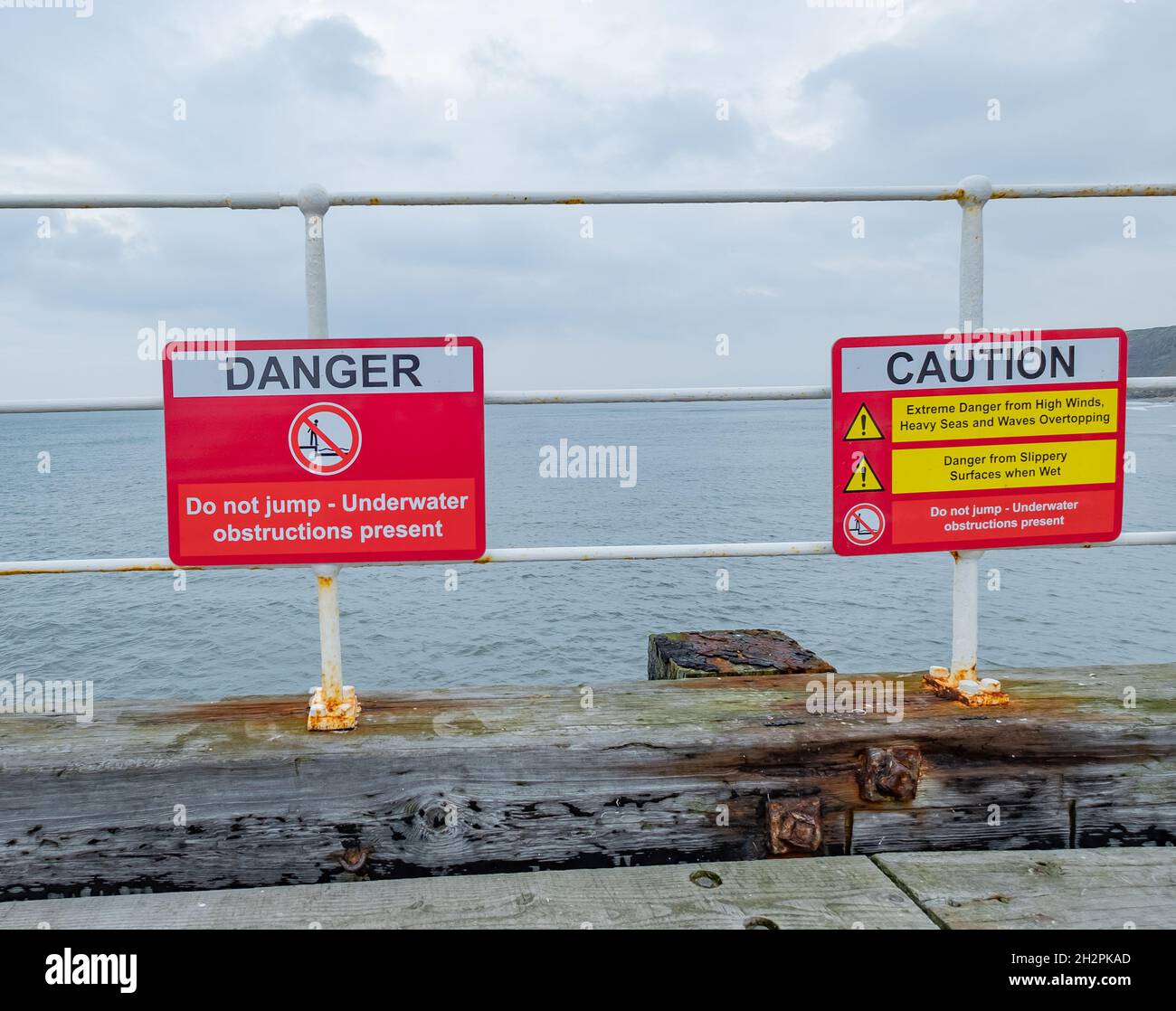 Whitby, Yorkshire, UK – October 18 2021. Close up of danger and warning ...