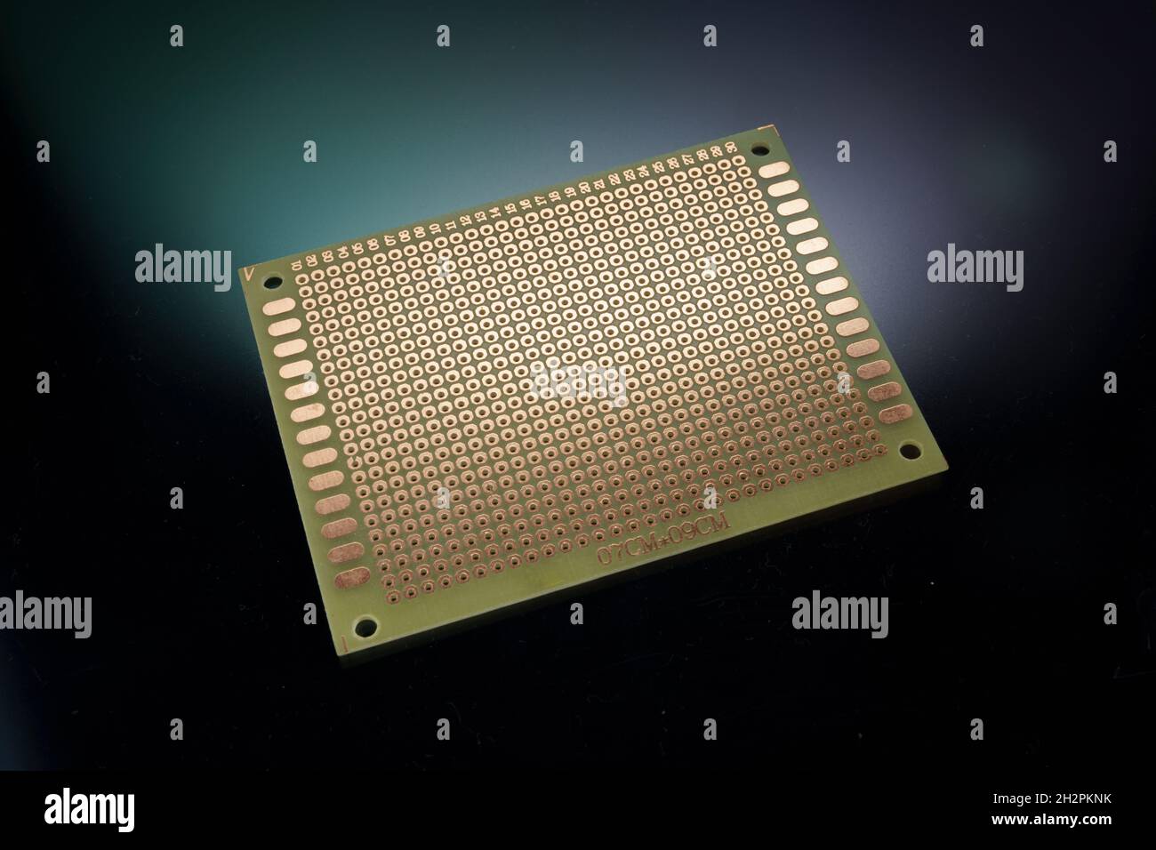 empty clear universal prototype printed circuit board on the background ...