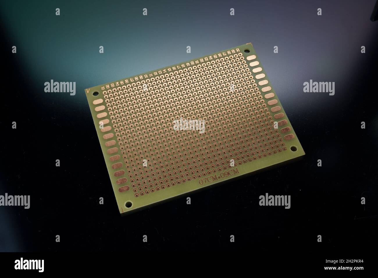 empty clear universal prototype printed circuit board on the background ...