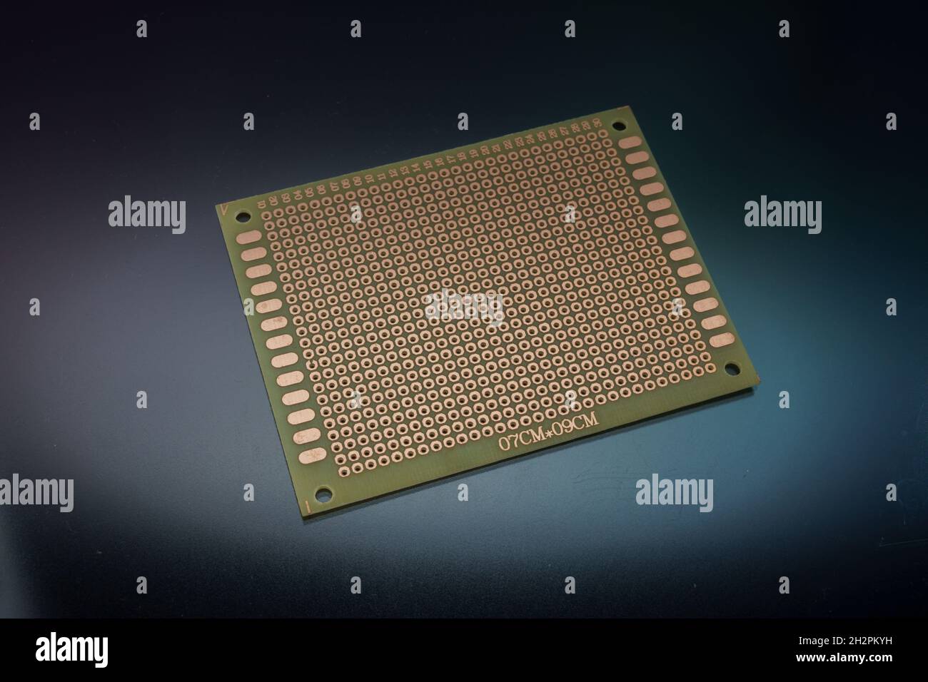 empty clear universal prototype printed circuit board on the background ...