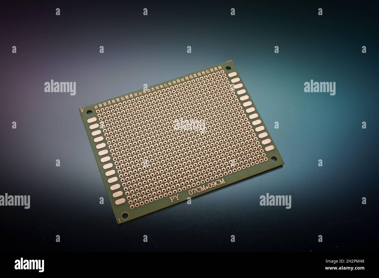 empty clear universal prototype printed circuit board on the background ...