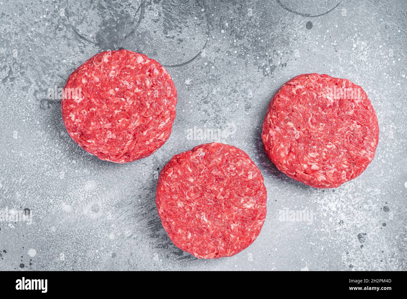 Raw Ground mince beef meat Burger steak cutlets. Gray background. Top ...
