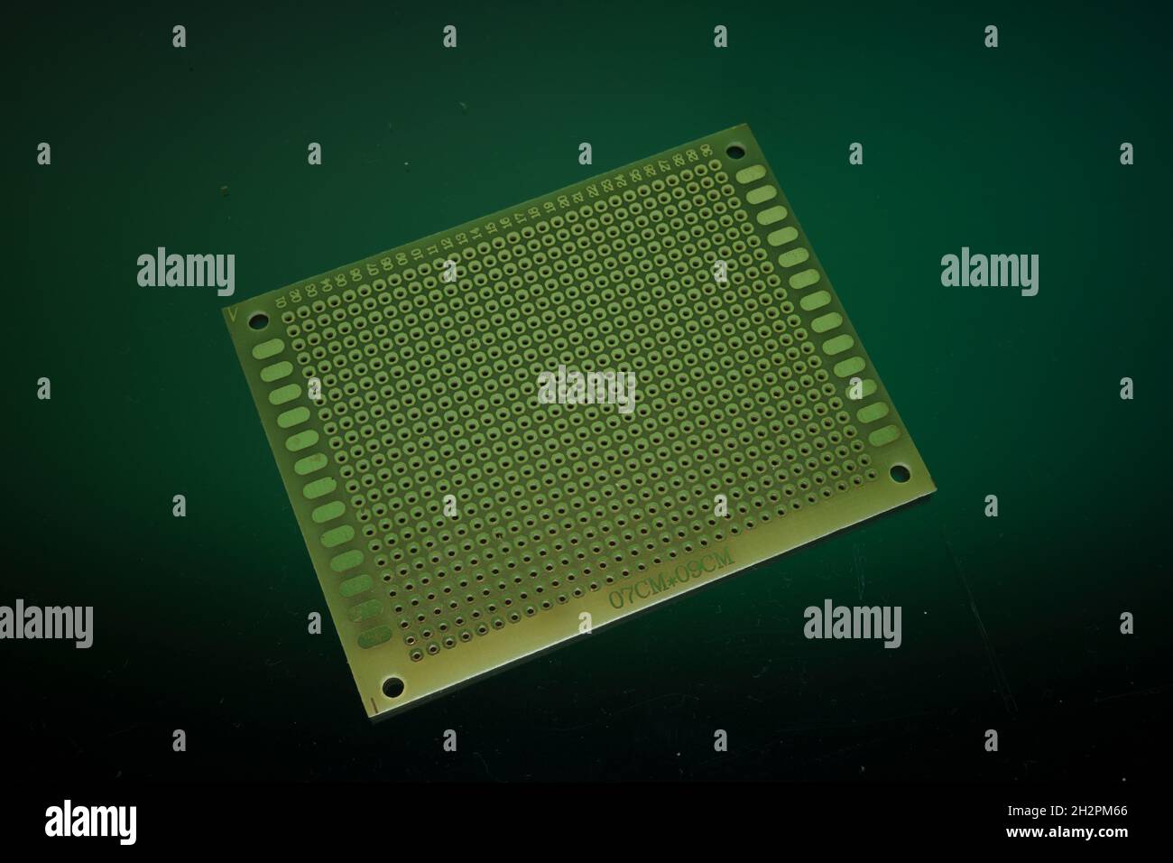 empty clear universal prototype printed circuit board on the background ...