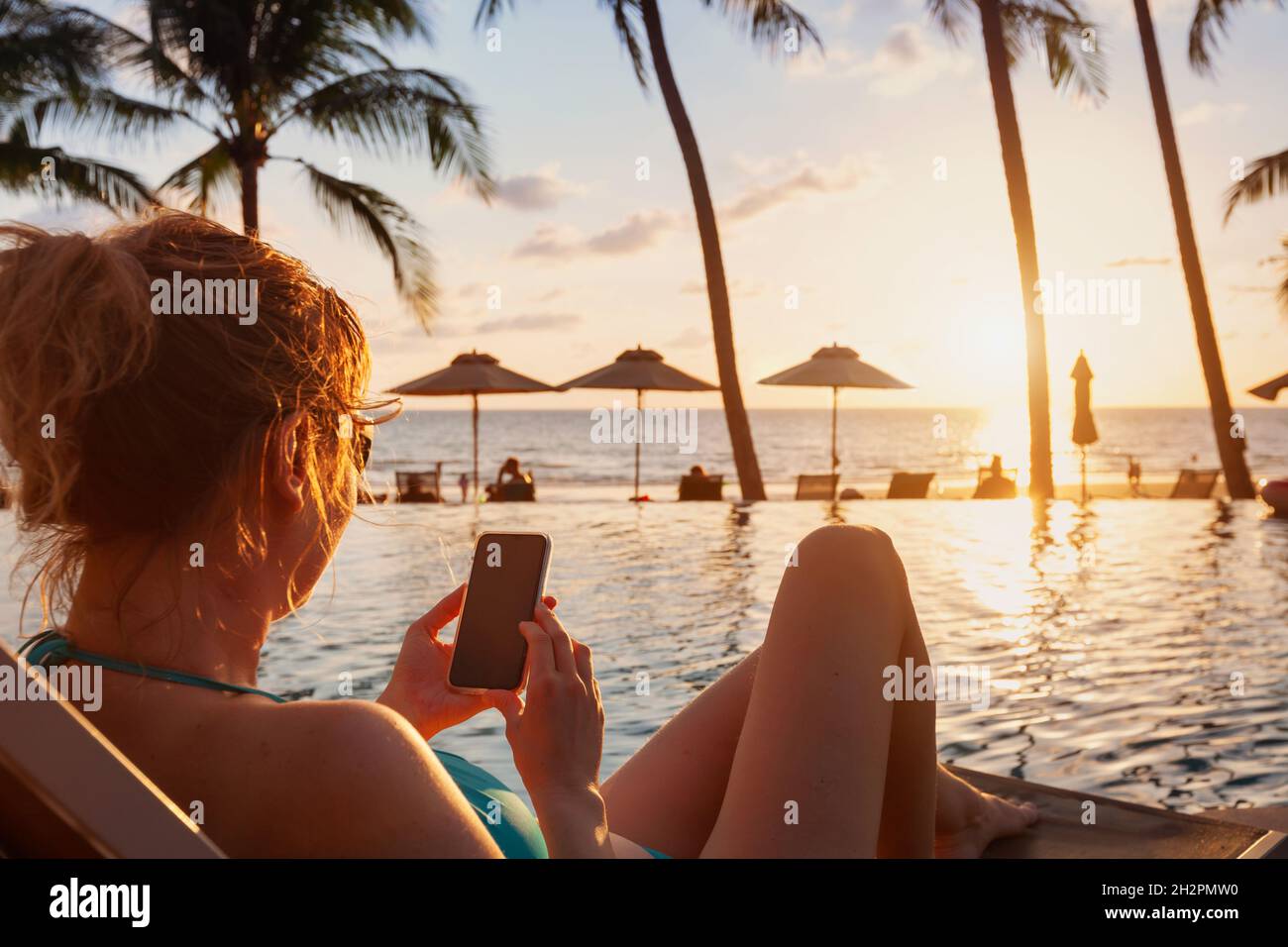 Woman Using Smartphone On Beach Luxury Hotel Near Swimming Pool Travel