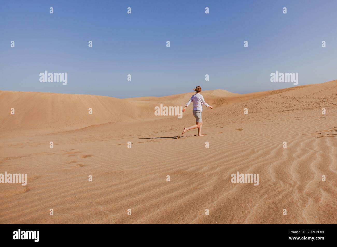 woman tourist running in sand dunes Stock Photo - Alamy