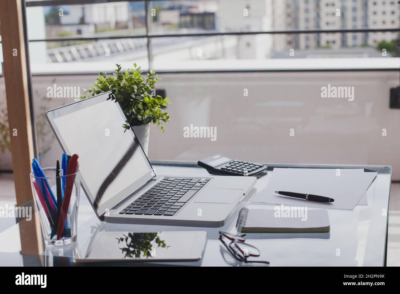 office workplace, workspace with laptop computer on glass table ...