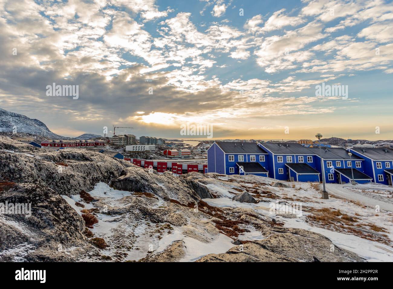 Arctic Inuit houses on the rocky hills in sunset panorama. Nuuk ...