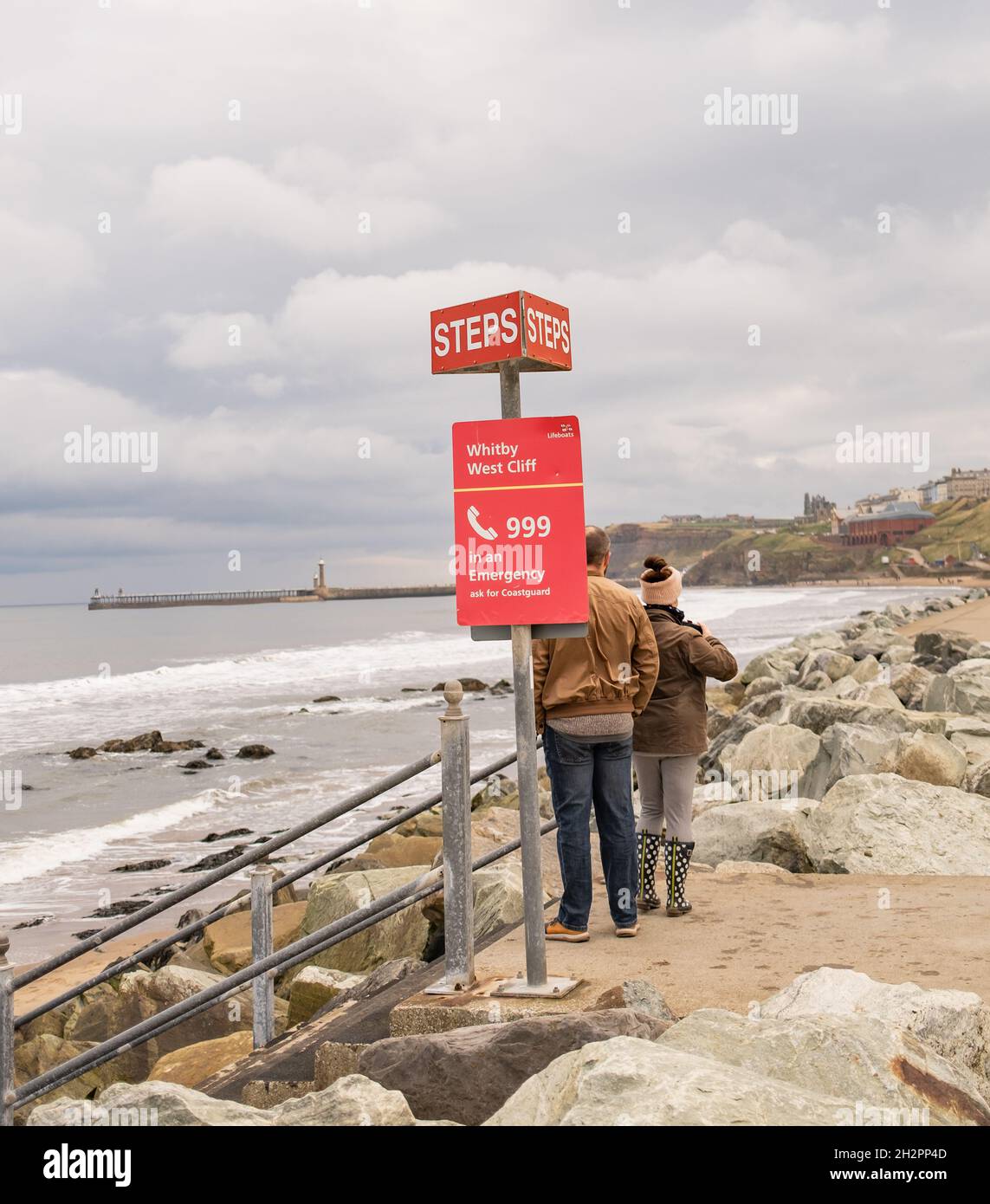 Whitby, North Yorkshire, UK – October 17 2021. Unidentifiable couple ...