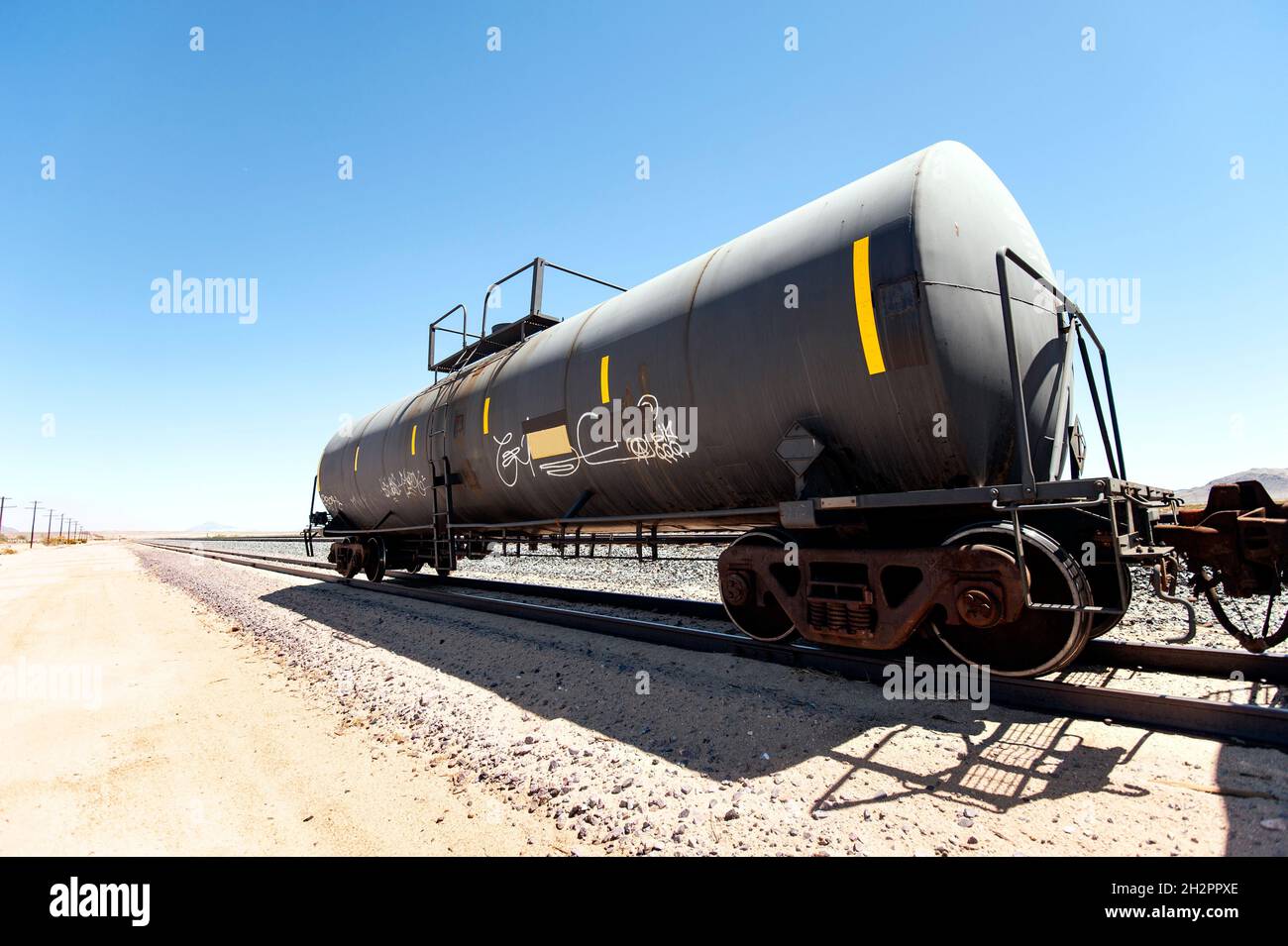 Graffiti tanker car connected and ready to move Stock Photo - Alamy