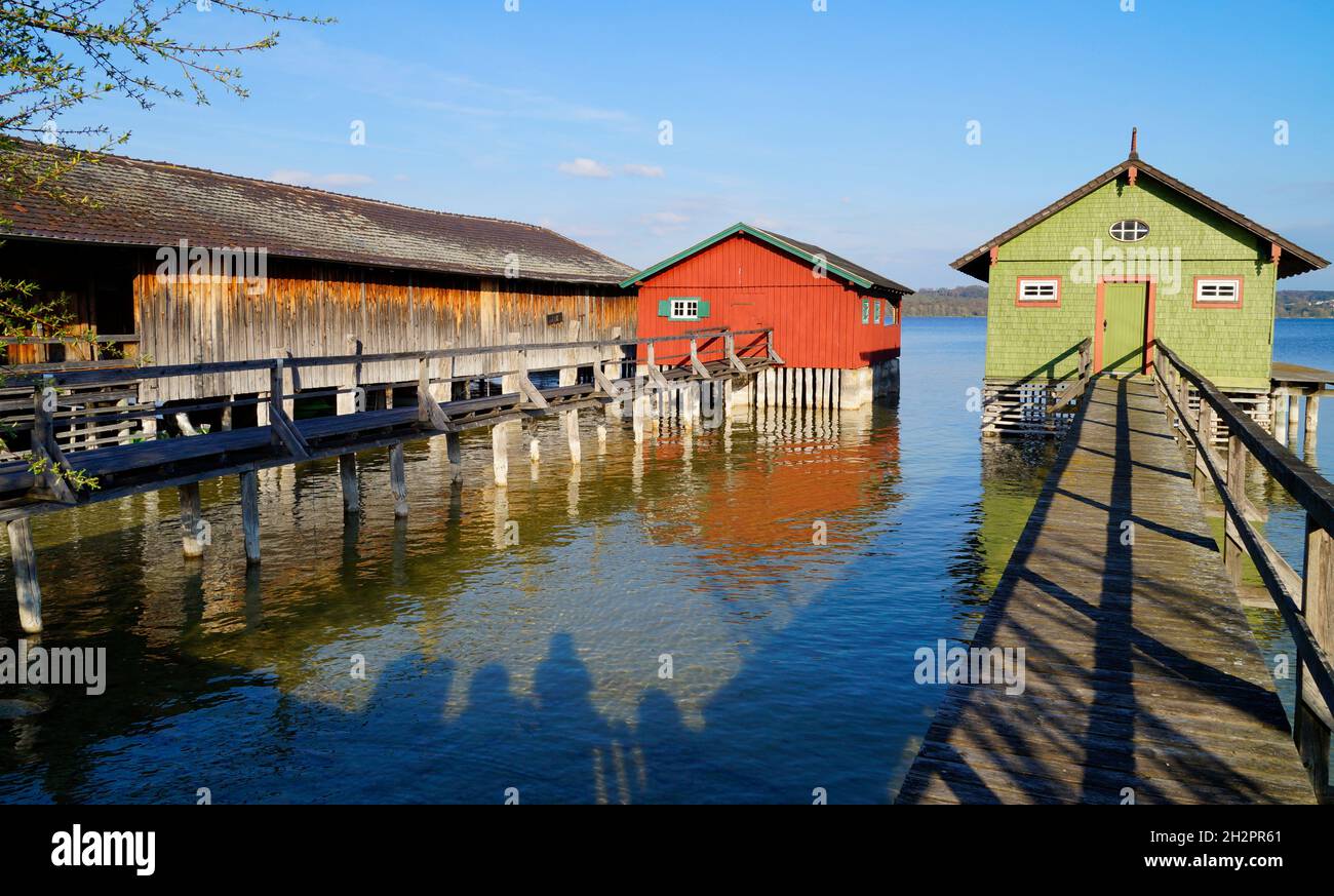 colorful boat houses on lake Ammersee in the German fishing village ...